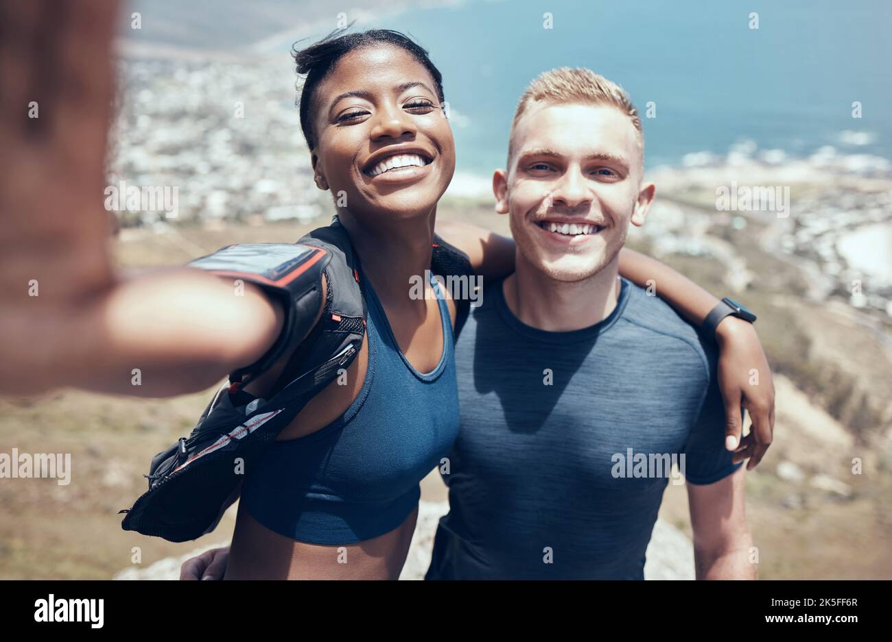 Happy, selfie and couple hiking in nature while on outdoor adventure ...