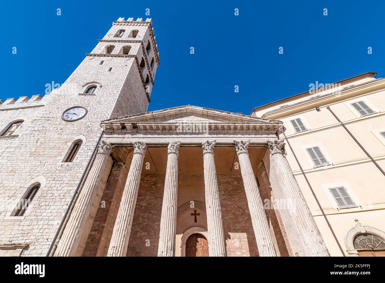 Temple of Minerva and Torre del Popolo in the historic center of Assisi ...