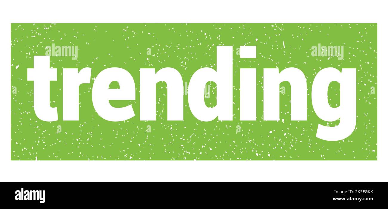 trending text written on green grungy stamp sign Stock Photo - Alamy