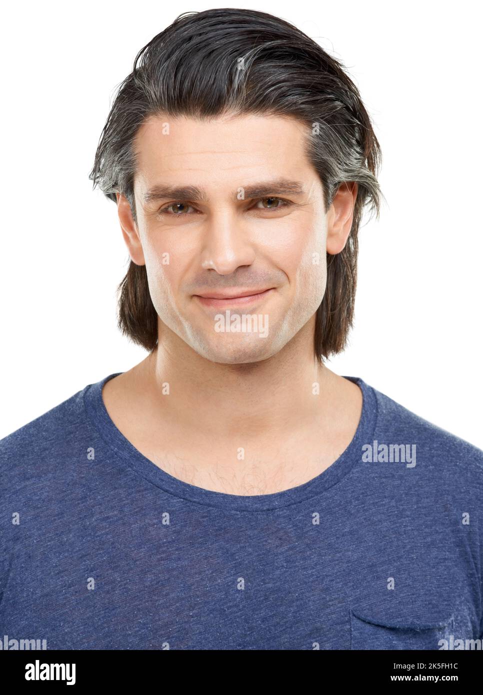 Modern man. Studio portrait of a handsome man posing against a white ...