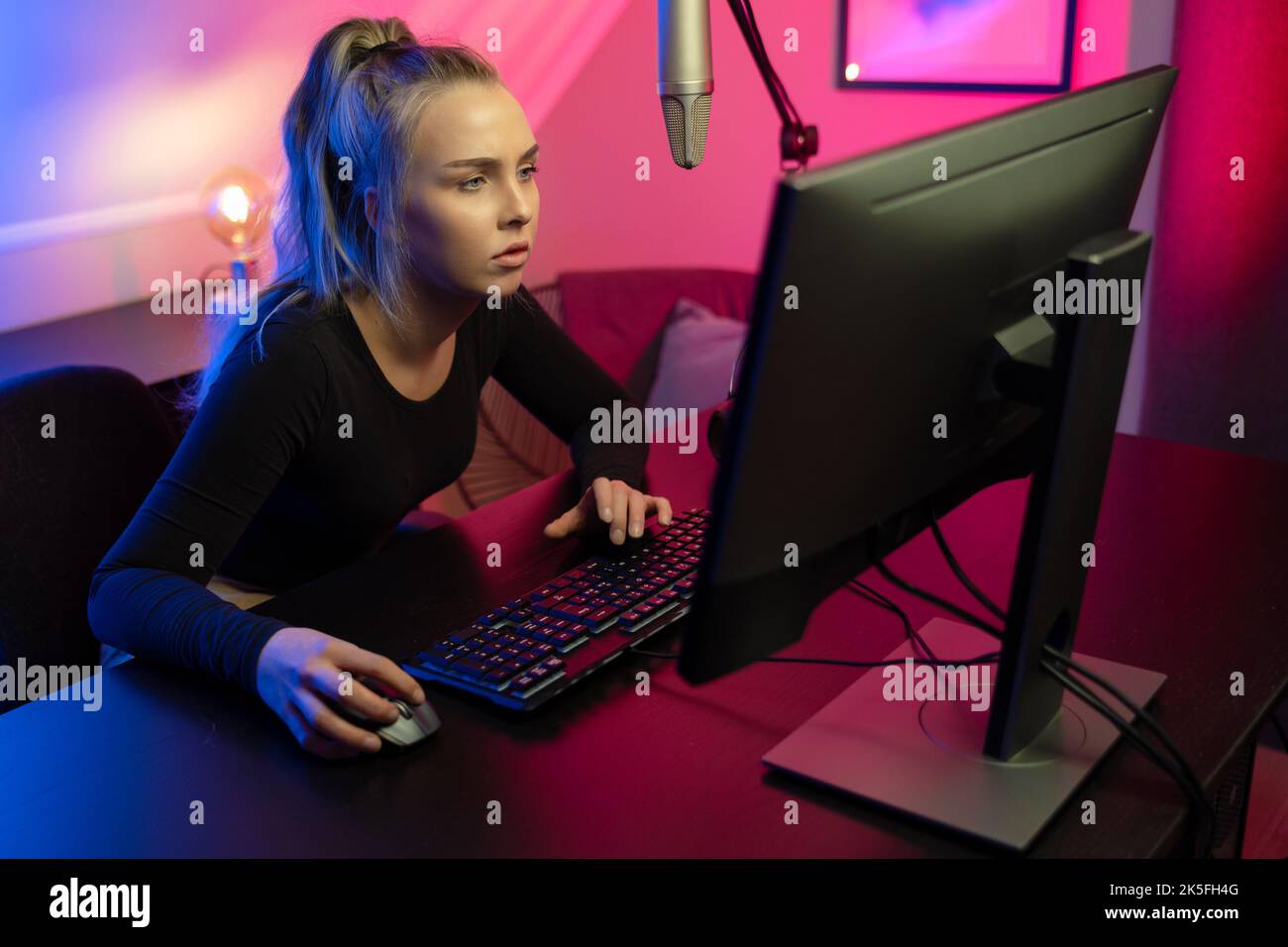 Focused Professional E-sport Gamer Girl with Headset Playing Online ...