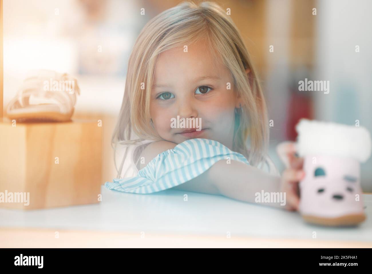 Girl child, retail shopping for shoes and choosing pink kids winter ...