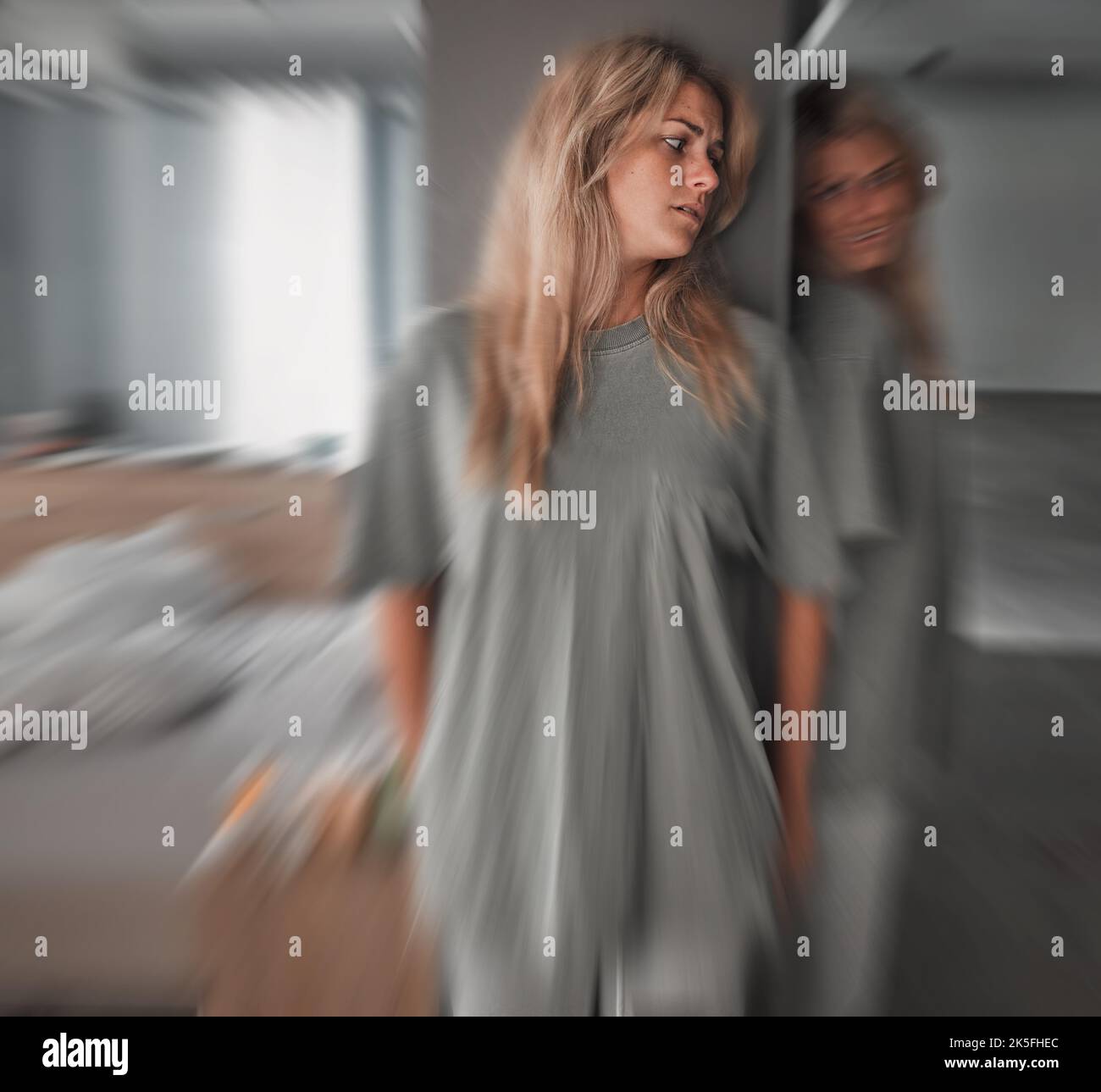 Bipolar, depression and scared young woman in a bedroom with worry ...