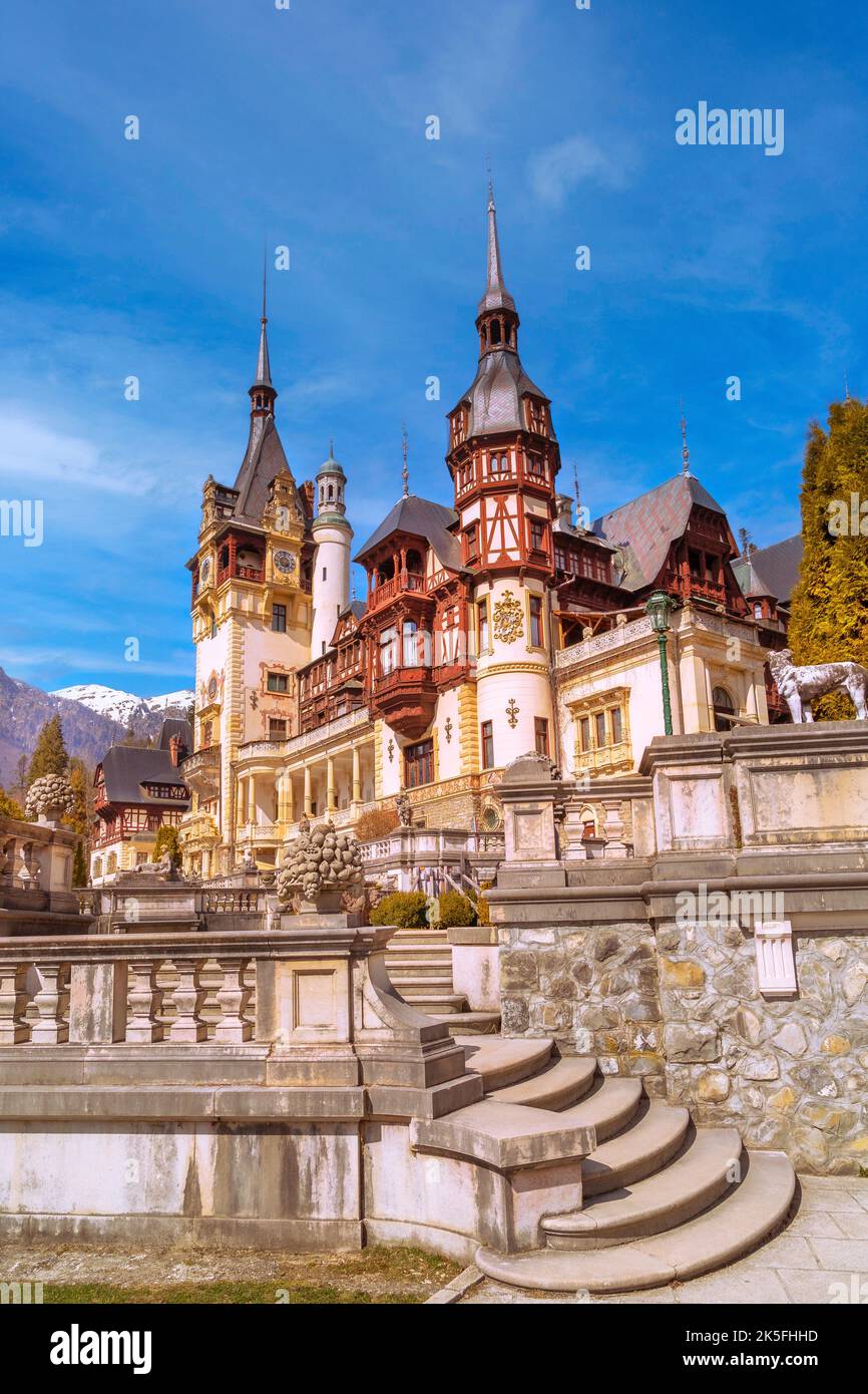 Peles castle close-up view and Carpathian mountains snow peaks, Sinaia ...