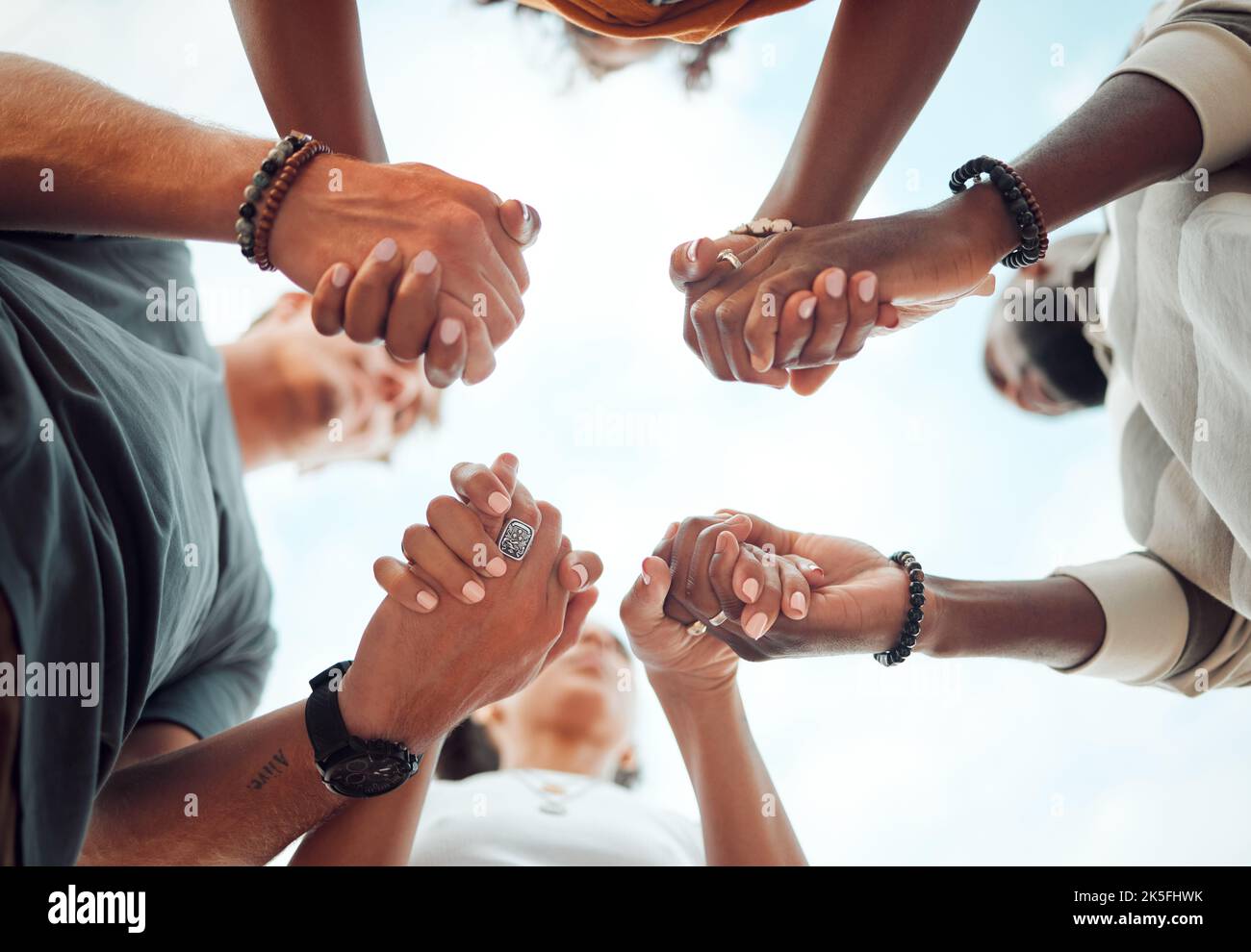 Holding hands, support and friends praying for spiritual growth ...