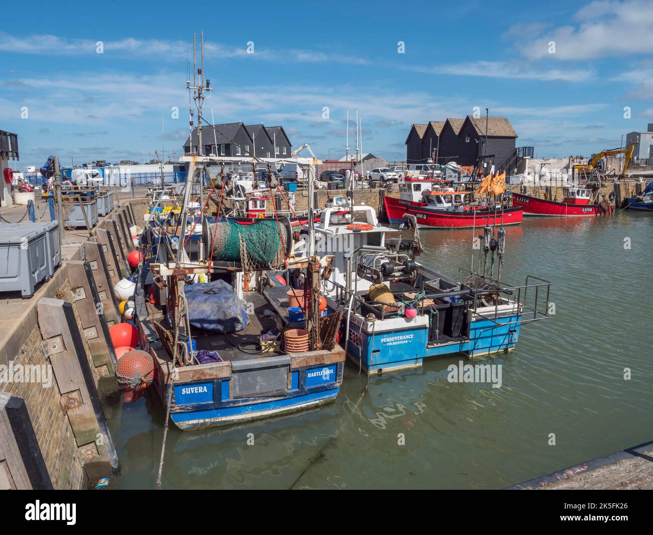 General view of fishing boats in Whitstable Harbour, Whitstable, Kent ...
