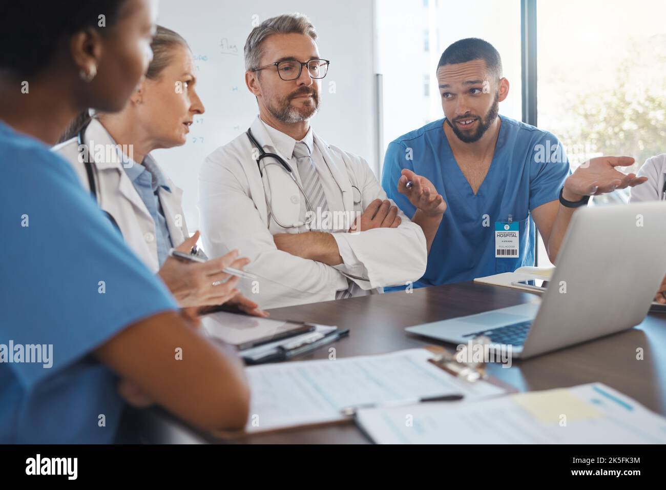 Leadership, doctor and teamwork planning on laptop in conversation, discussion and meeting for ...