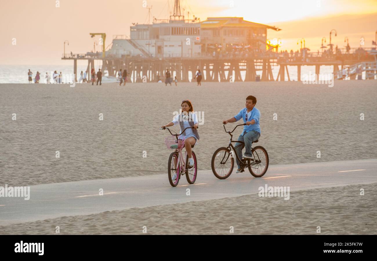 Bikers on Santa Monica State Beach in front of Santa Monica Pier. This ...