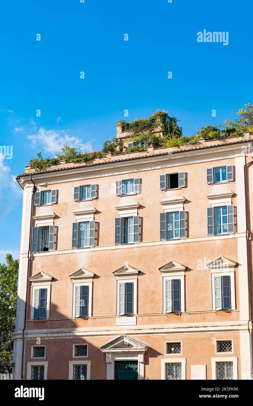 Historic Roman palazzo with rooftop garden and traditional shuttered ...