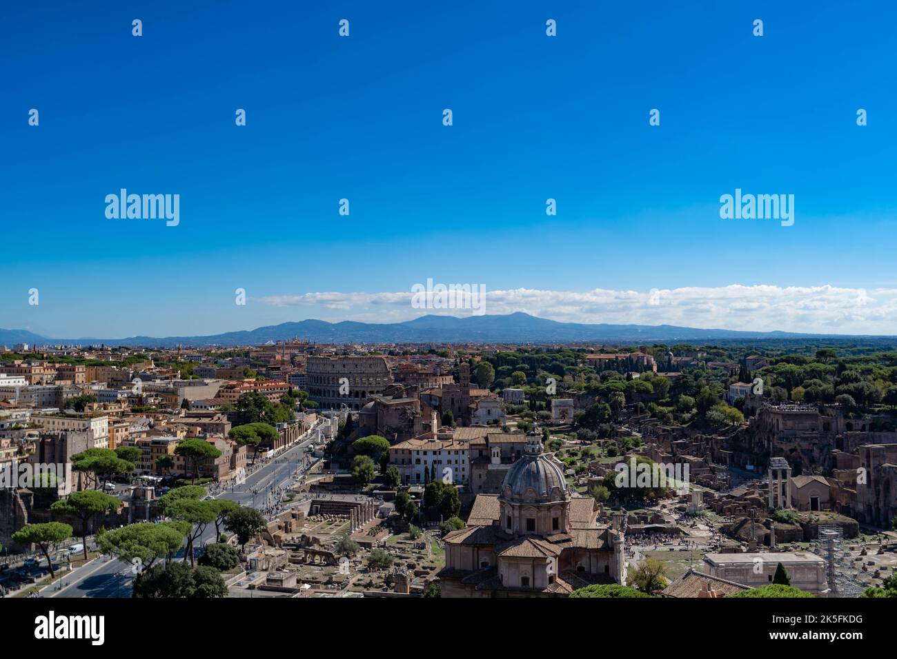 Panoramic aerial view of Rome showing Colosseum and Roman Forum under ...