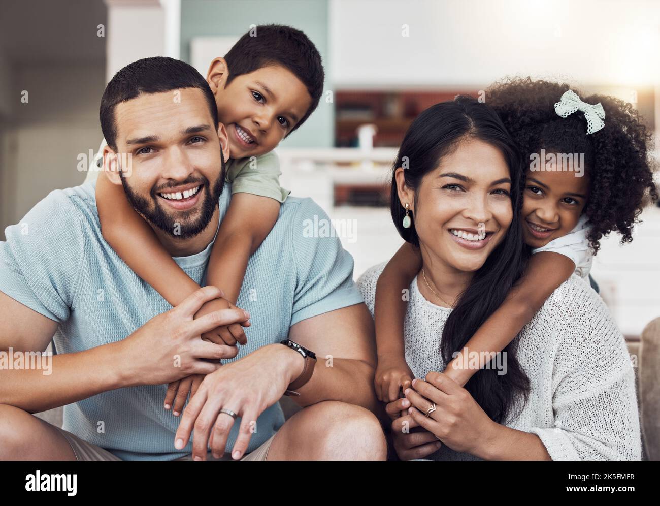 Children hug, home relax and parents with smile for happy house on the ...