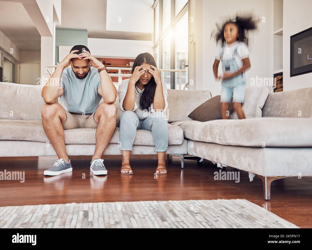 Tired parents, frustrated and active child being naughty and playful ...