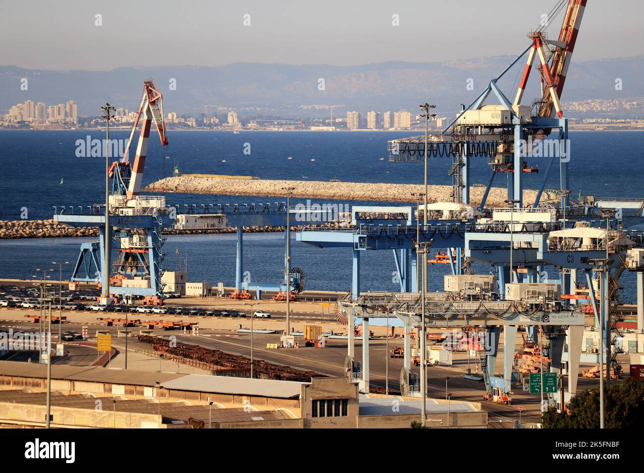 The industrial shipping harbor of Haifa with cranes Stock Photo - Alamy