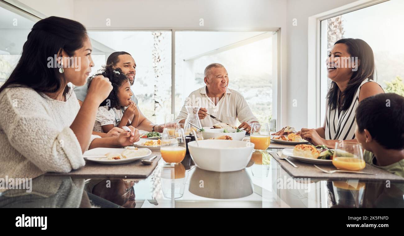 Family, grandparents and children eating breakfast together in the ...