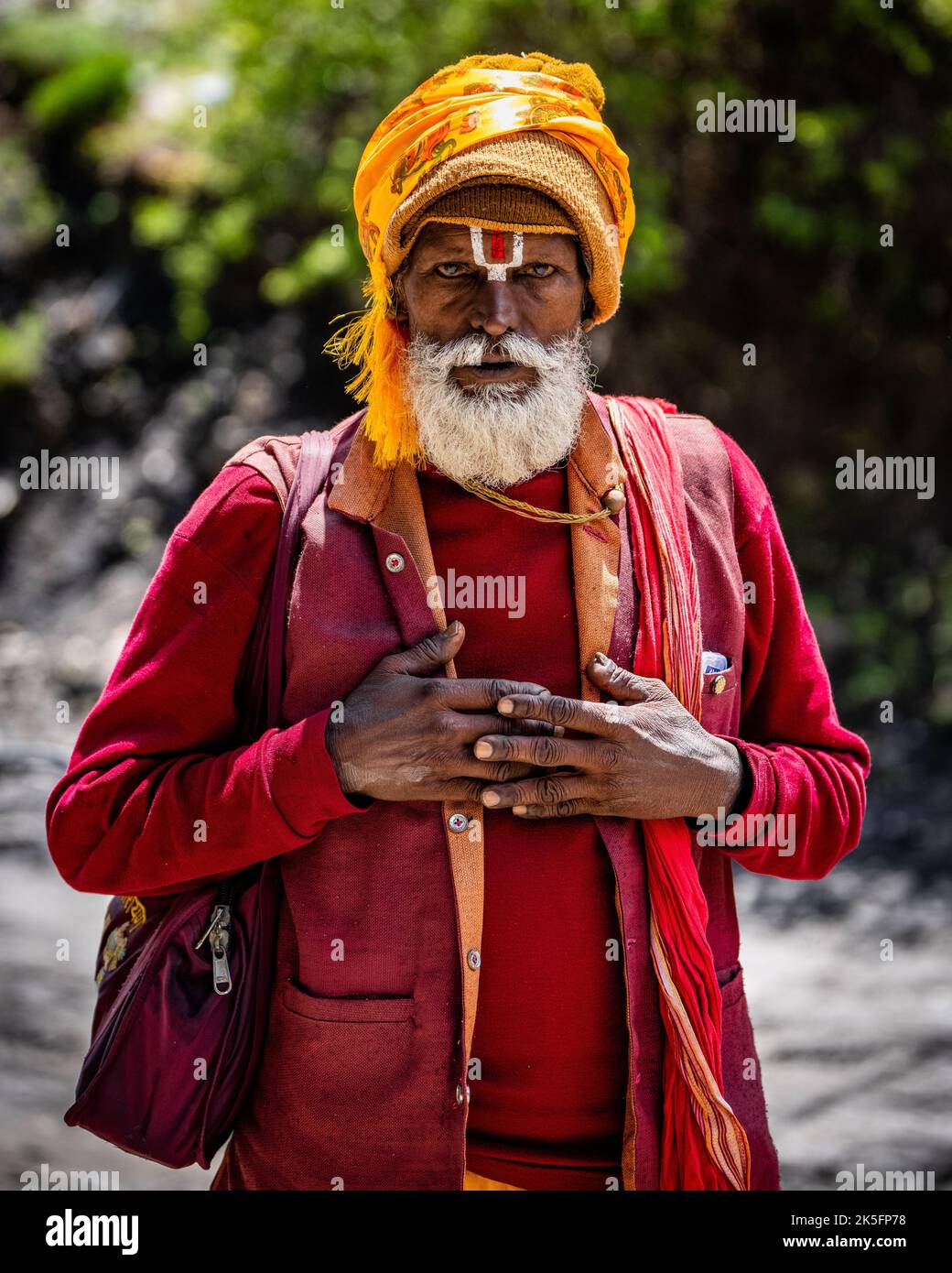 A vertical shot of a Baba Ji Pilgrim at Muktinath Mountain Temple in ...