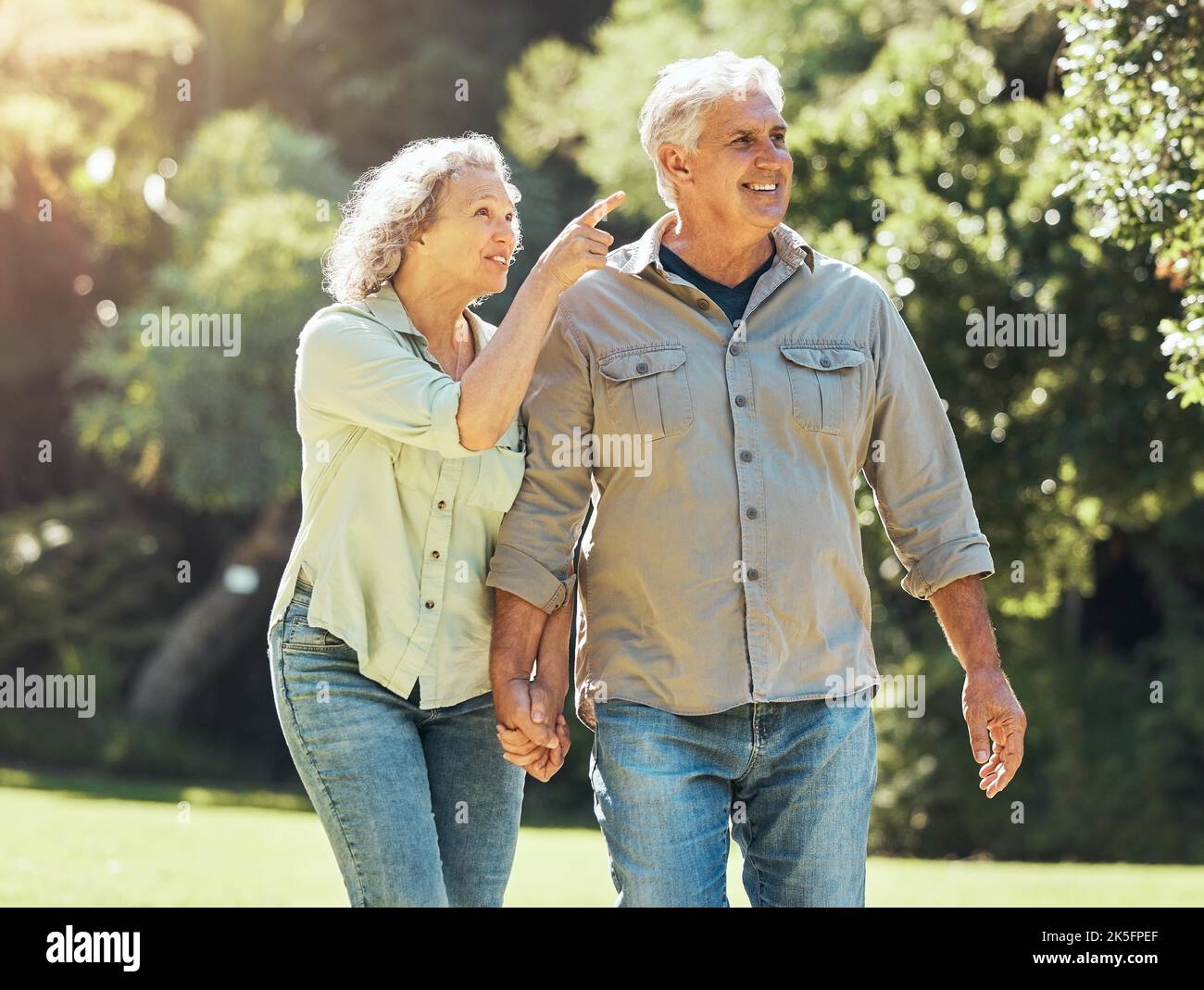 Senior couple, outdoor and conversation in nature park and active on ...