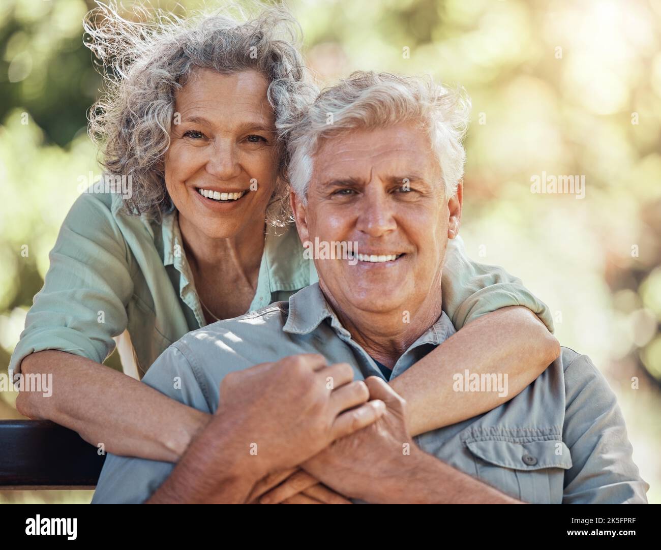 Love, hug and senior couple bond in house garden, nature park or home ...