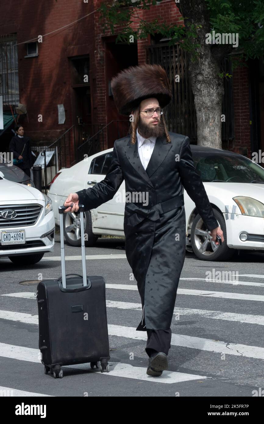 An orthodox Jewish man preparing for Sabbath wears a shtreimel fur hat ...