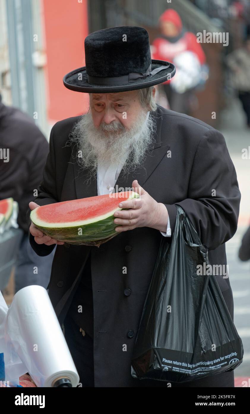 An older orthodox Jewish man shops for groceries just prior to the ...
