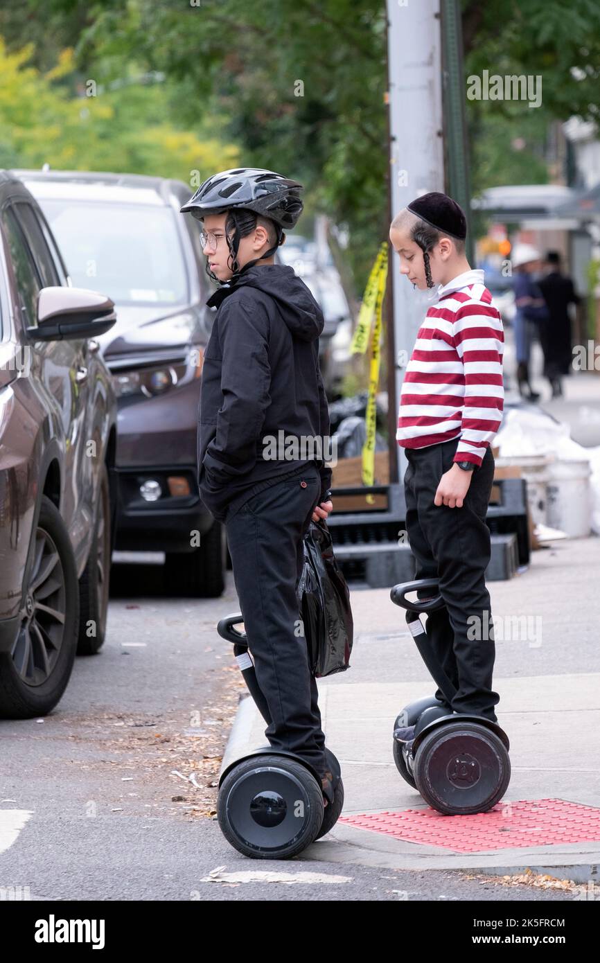2 orthodox jewish boys with long curly peyot ride hoverboards in ...