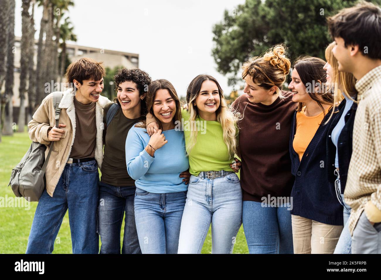 Happy group of teenagers having fun outside university - Young students ...