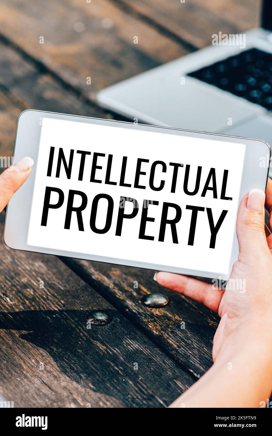 Hand writing sign Intellectual Property. Business overview work or ...