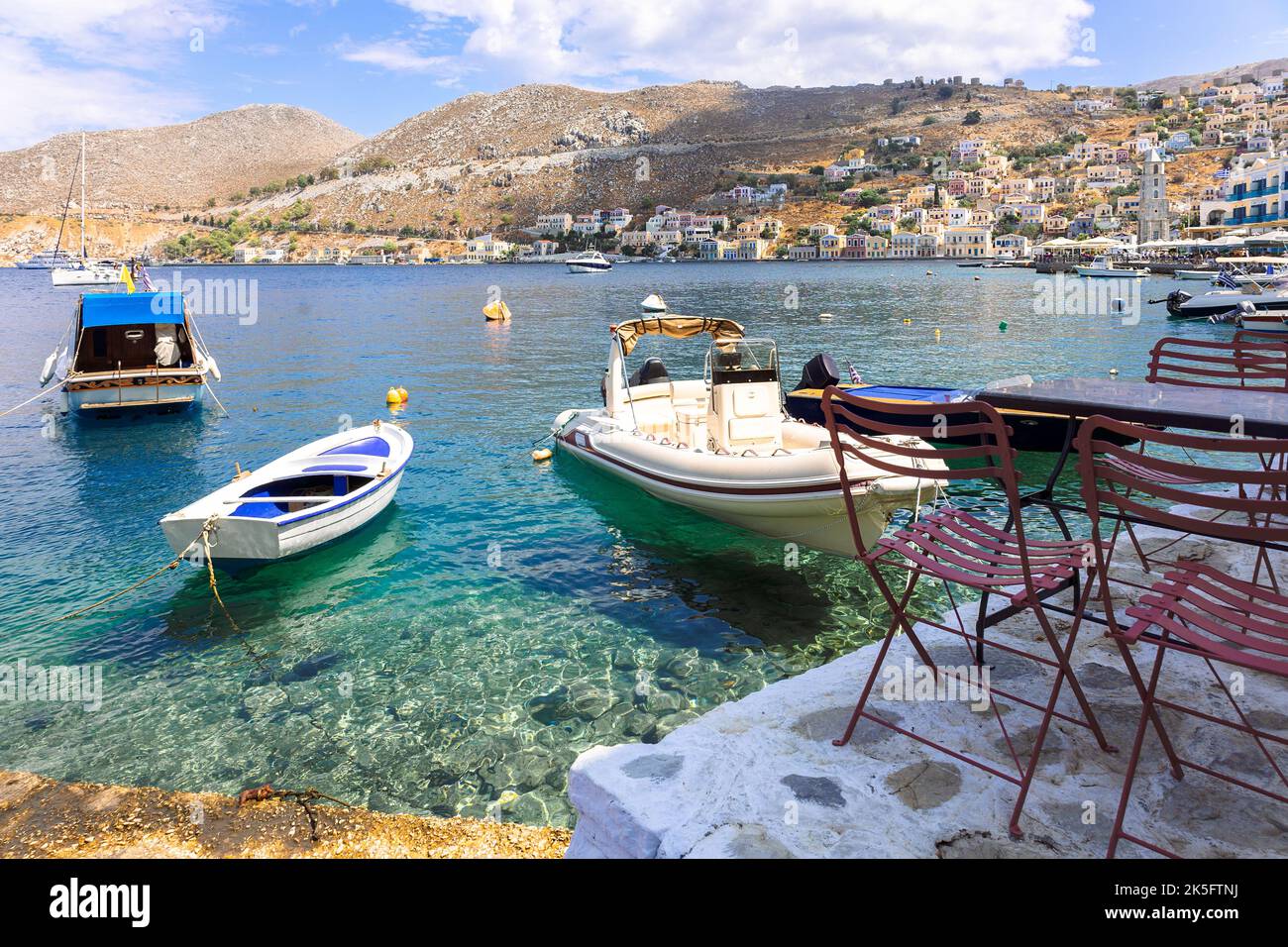 Panoramic view of small haven of Symi island. Village with tiny beach ...