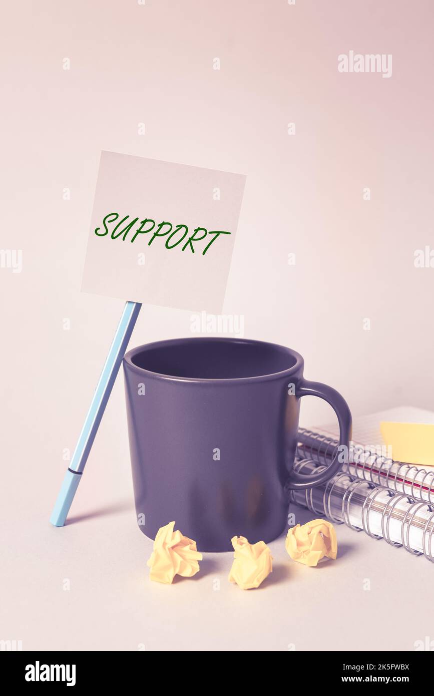 Hand writing sign Support. Business overview thing that bears the ...