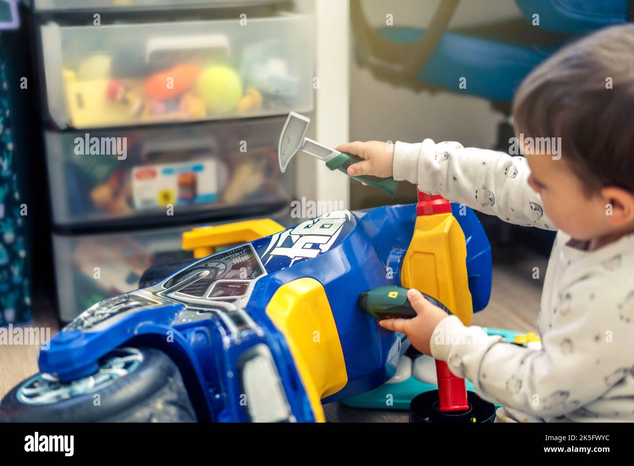 little boy playing repair the motorcycle Stock Photo - Alamy