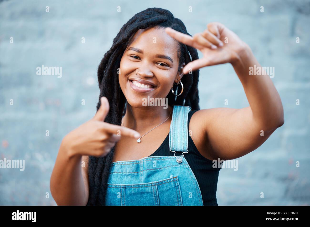 Black woman, hands and finger frame showing smile, happiness and face ...