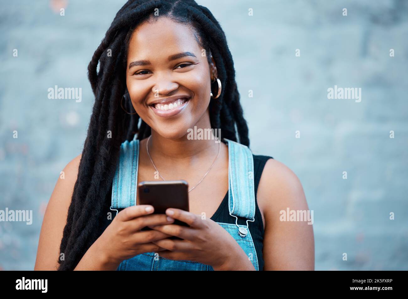 Black woman, portrait and city phone for social media typing, contact ...