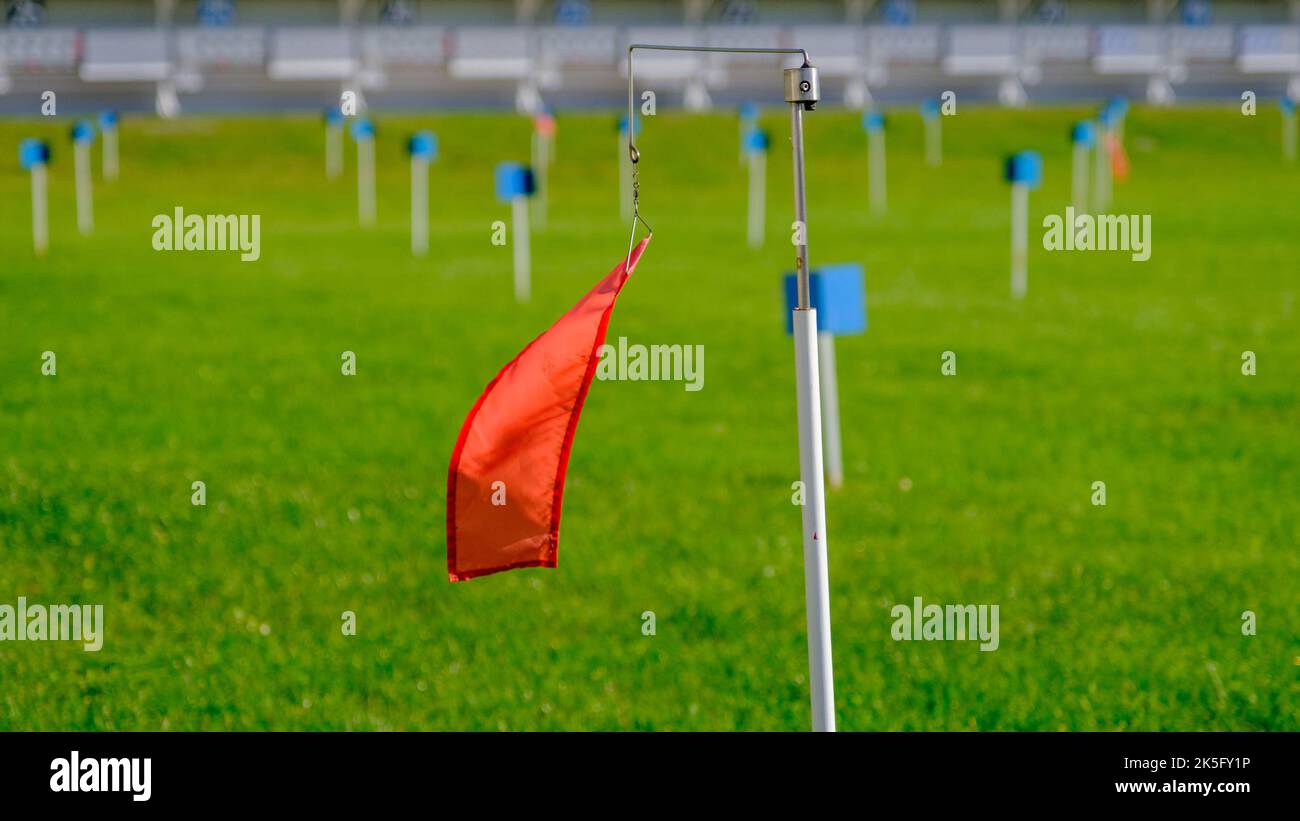 red wind direction flag biathlon shooting range. outdoor in the summer ...