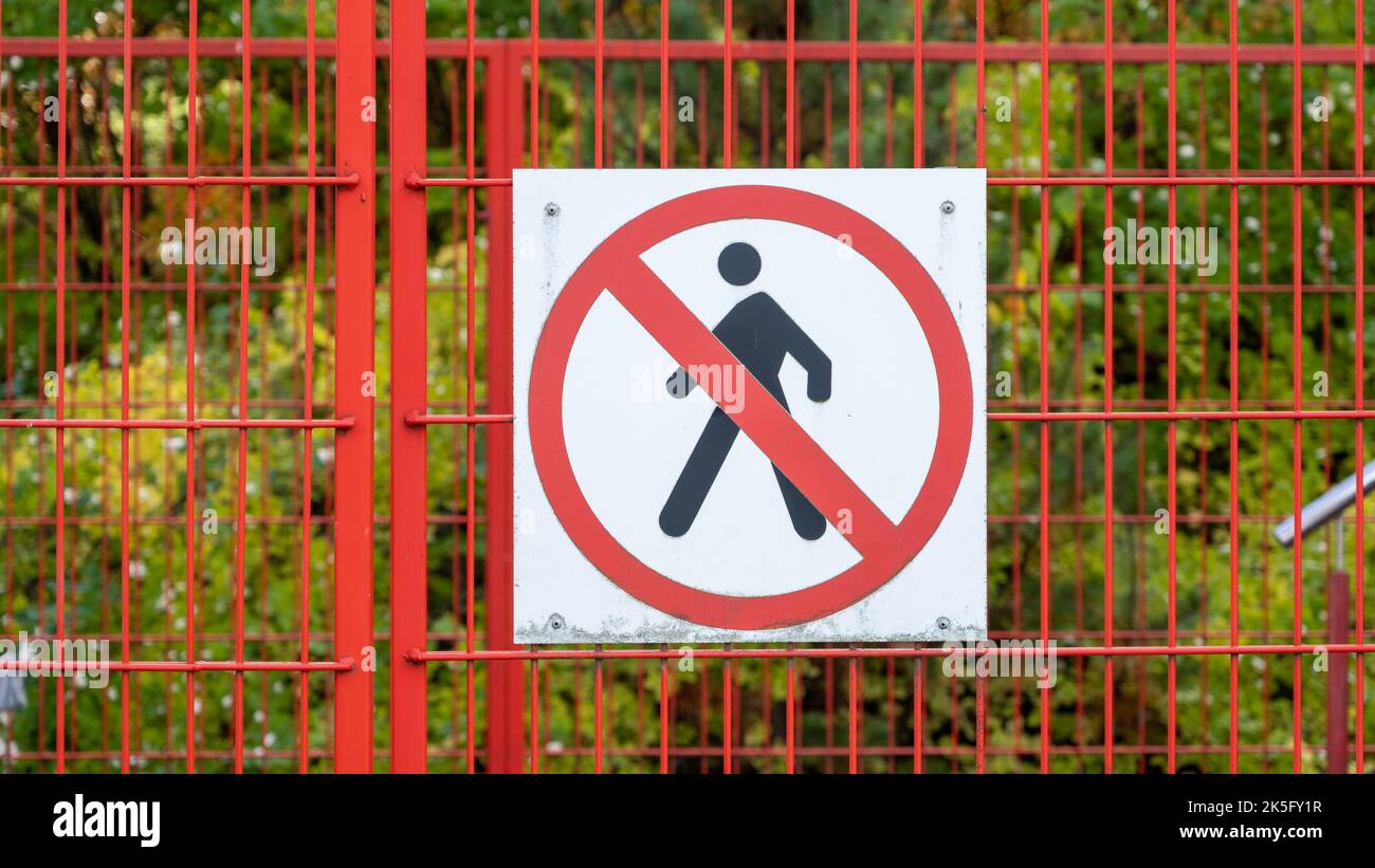 Closed access door to the construction site of a building, with a no ...