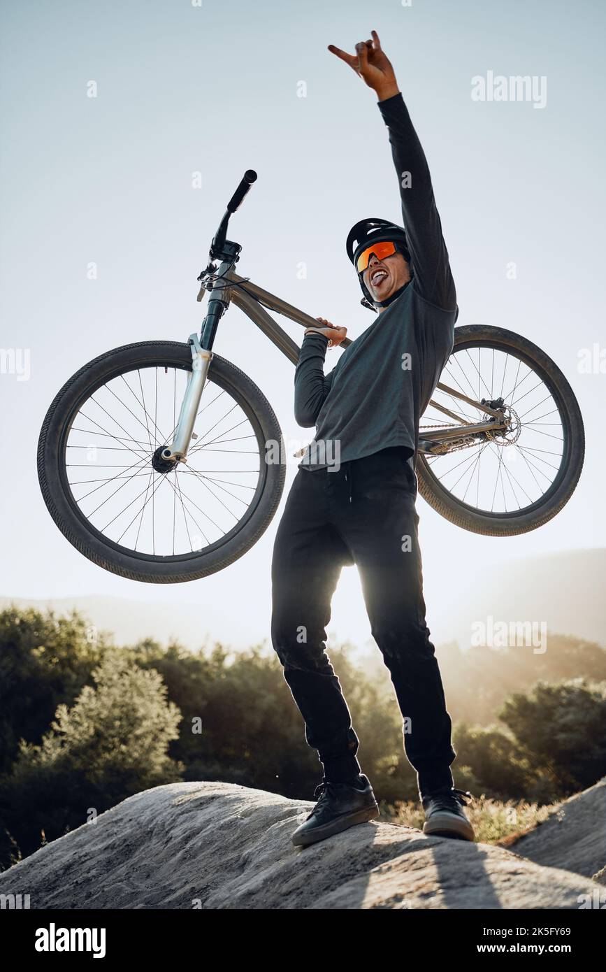 Man, mountain and bike celebrate, happy and excited after reaching ...