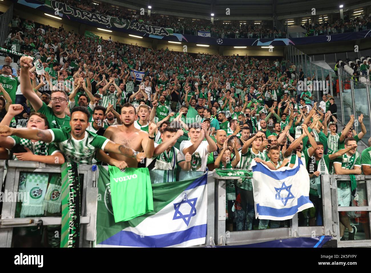 Turin, Italy, 5th October 2022. Maccabi Haifa fans get behind their ...