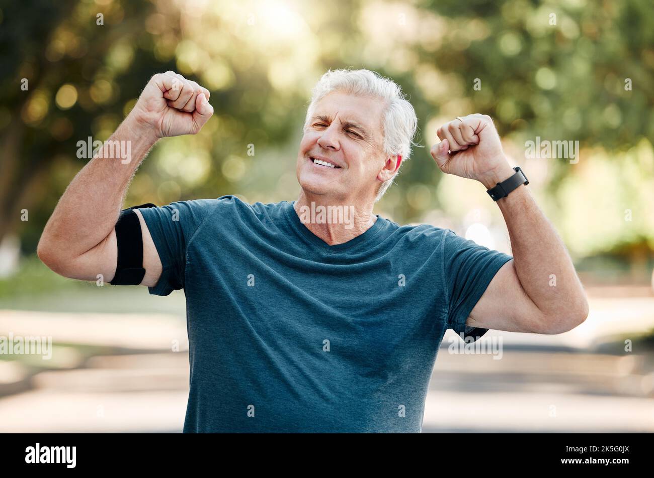 Running, senior man and success celebration in nature, park or outdoors ...