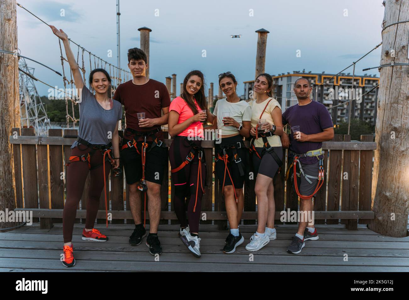 Group of rock climbers taking a photo and laughing whilst staning on ...