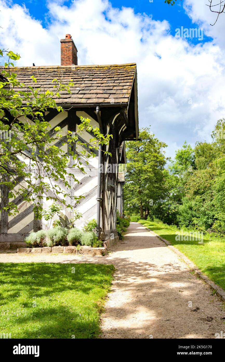 exterior of Tudor half timbered moated National Trust house Little ...