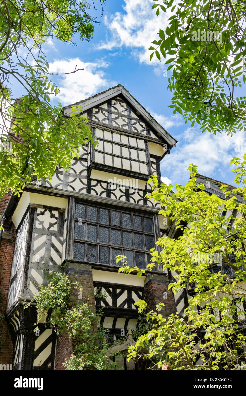 exterior of Tudor half timbered moated National Trust house Little ...