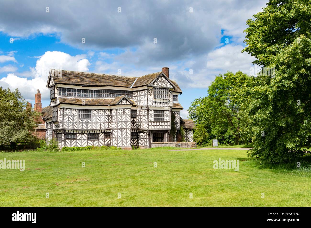 exterior of Tudor half timbered moated National Trust house Little ...