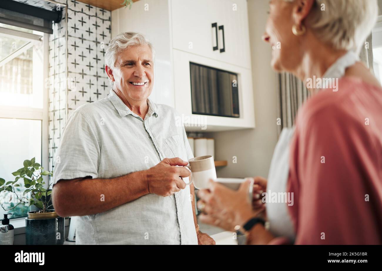 Senior man, drinking coffee and conversation with woman in kitchen at ...