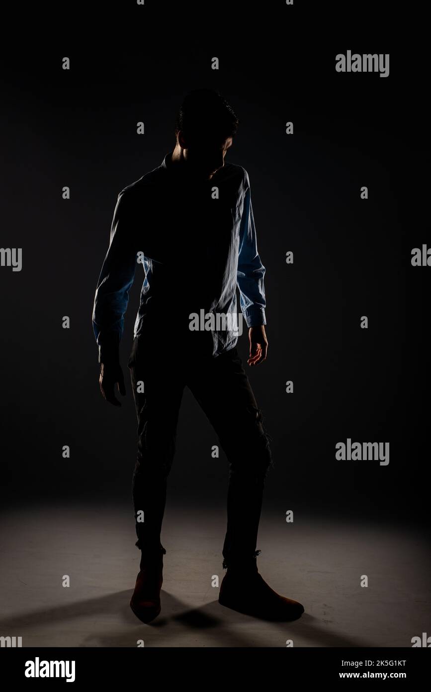 Dimmed light man hi-res stock photography and images - Alamy