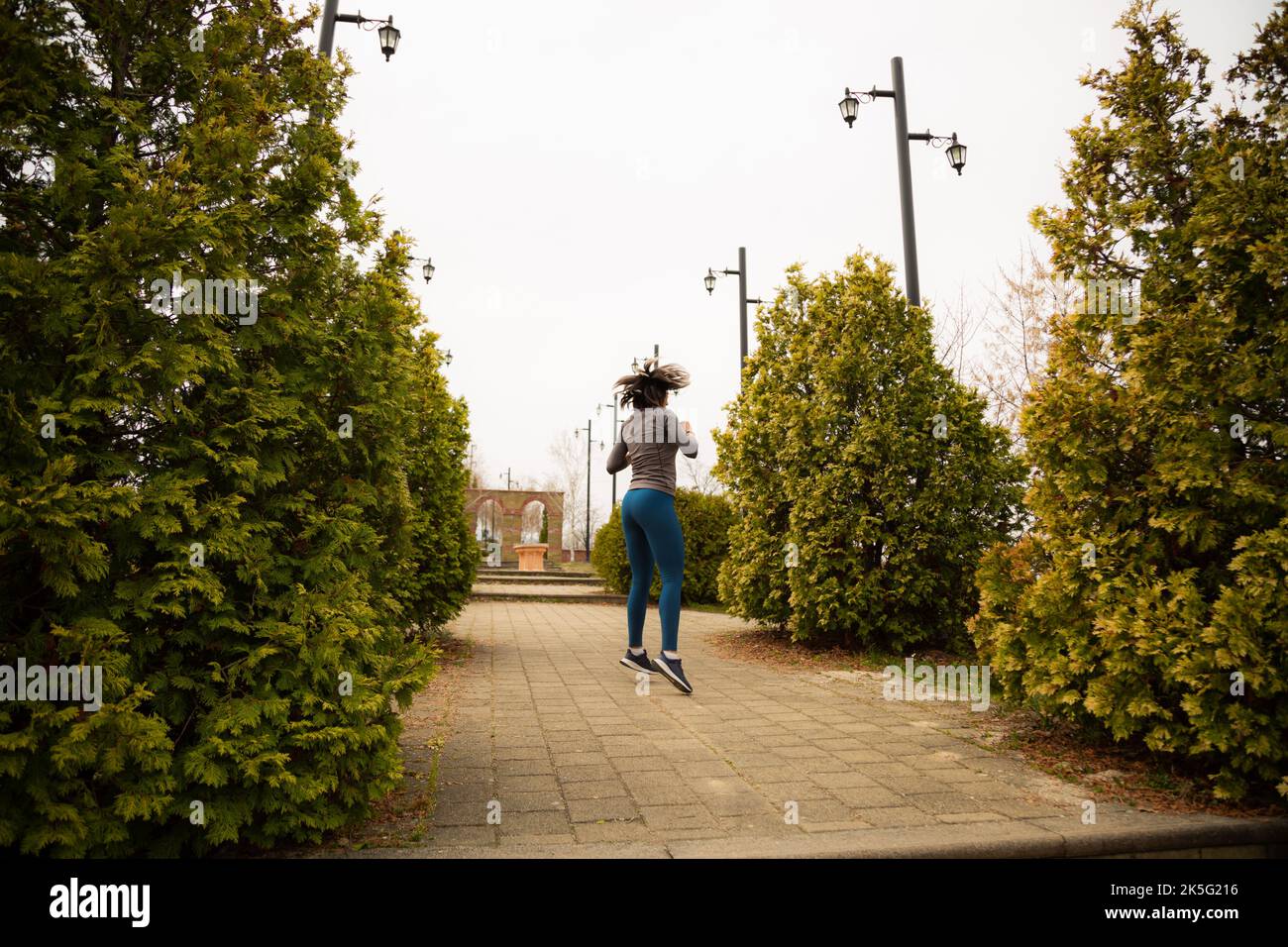 Girl jumping in water rear view hi-res stock photography and images - Alamy