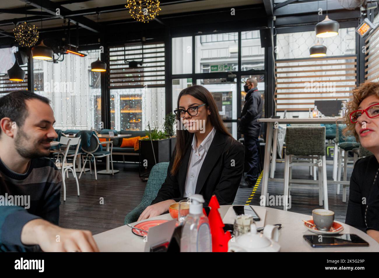 Three amazing business people are having a nice conversation togehter ...