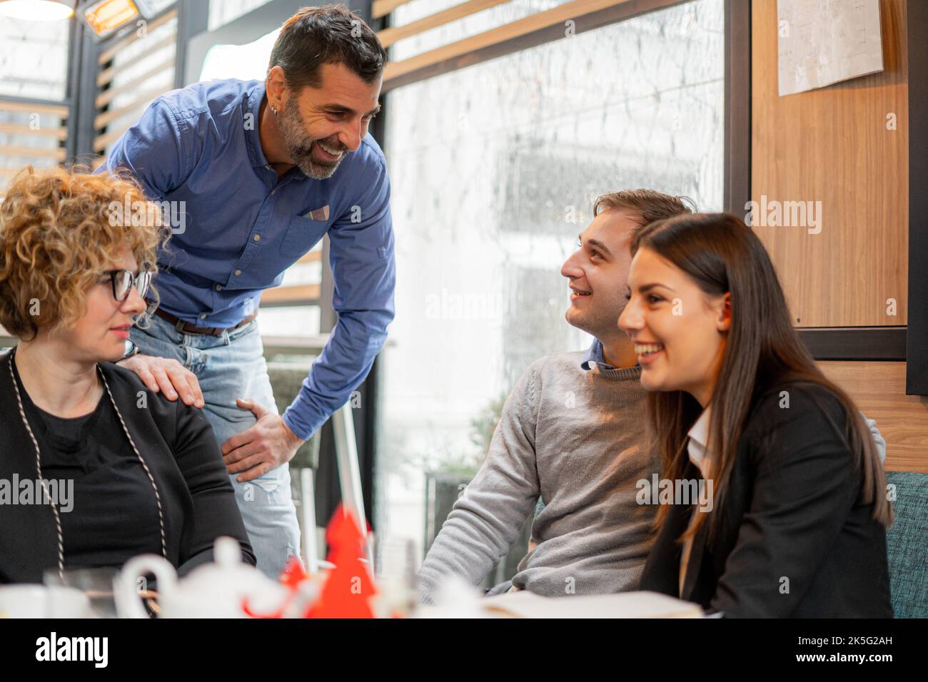 Collaborating four coworkers in hi-res stock photography and images - Alamy