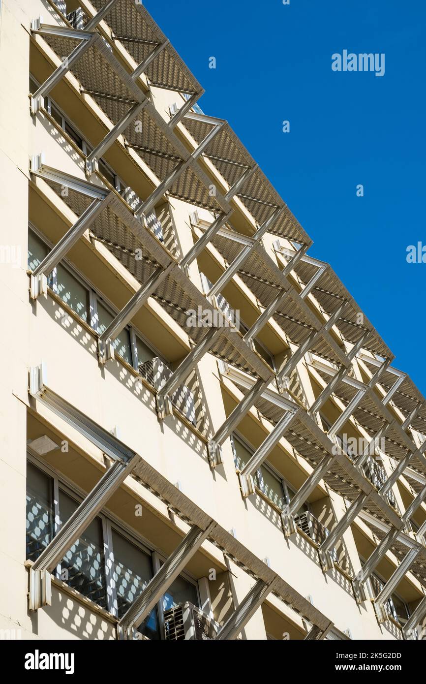Facade with shutters on a sunny day. Architecture, shadows, diagonals ...