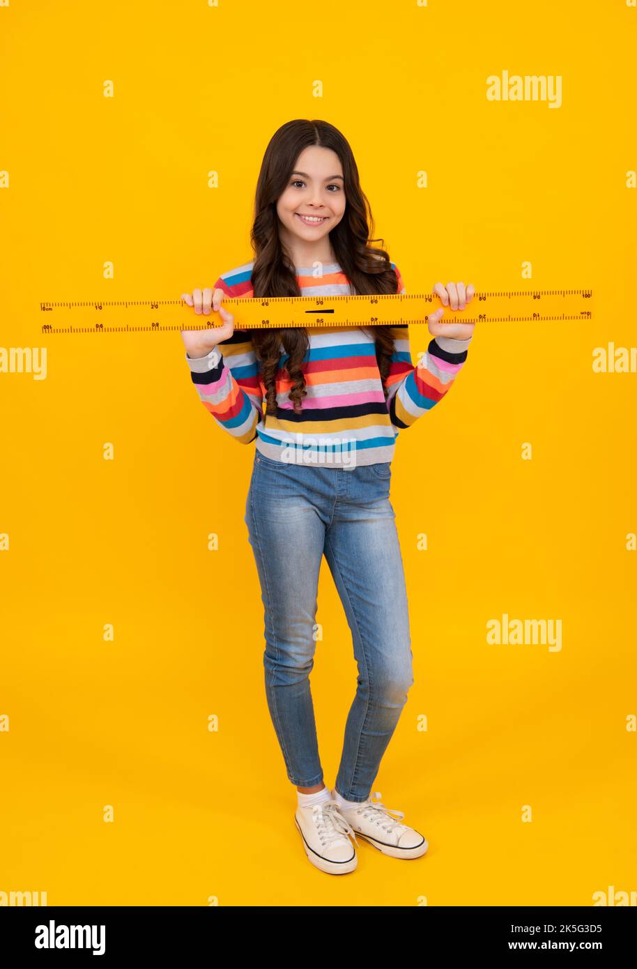 Teenager child school girl holding measure for geometry lesson ...