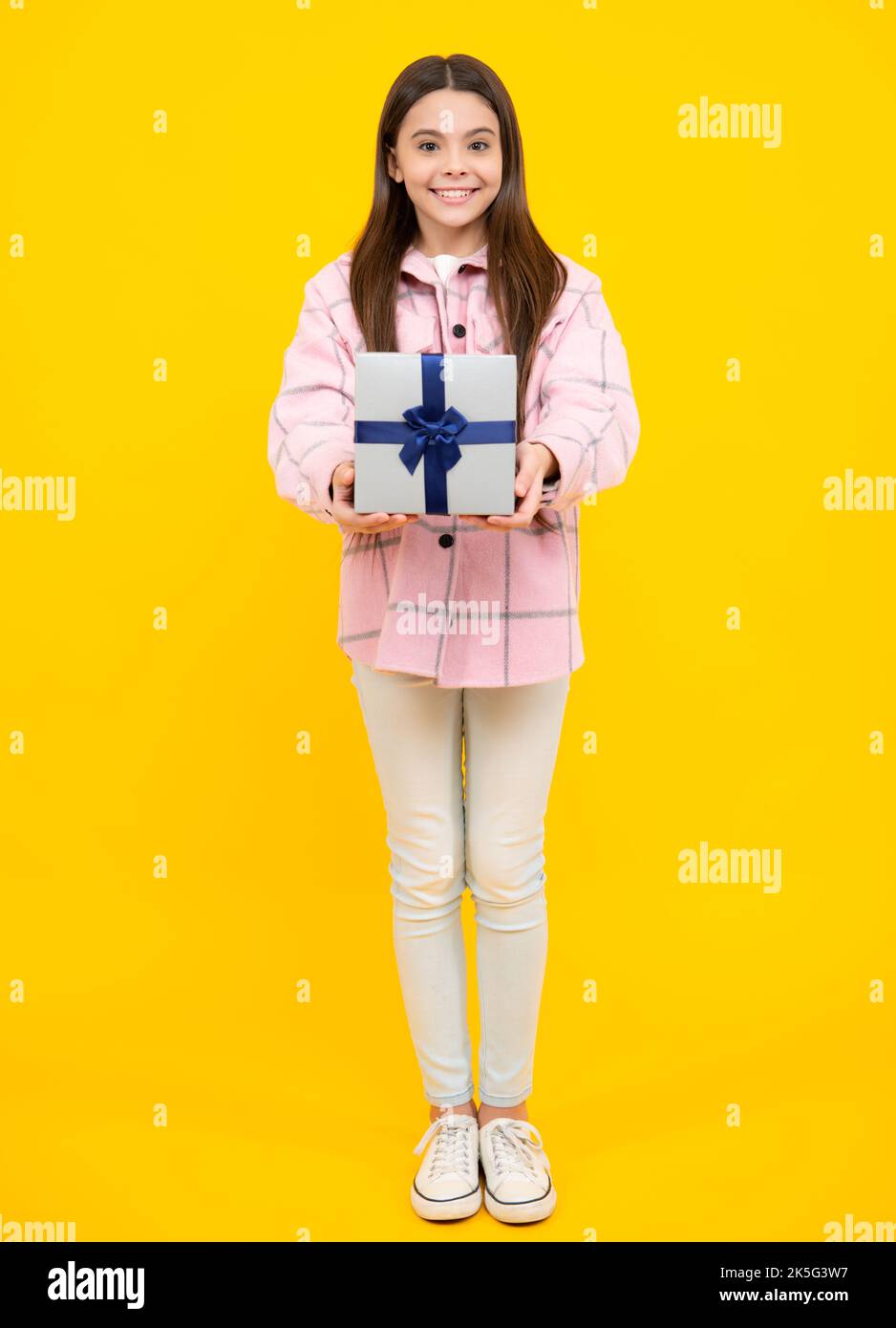 Teenager kid with present box. Teen child girl giving birthday gift ...