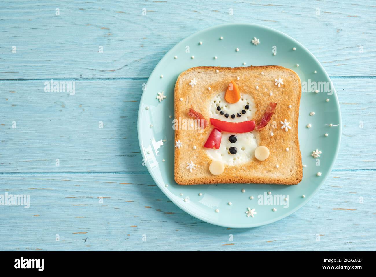 Christmas breakfast: toast with egg white in the shape of happy snowman ...