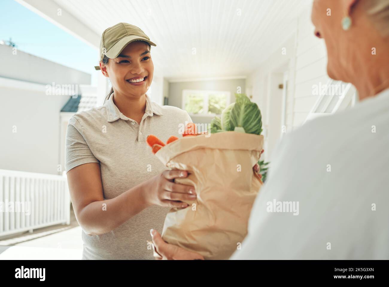 Woman, smile and grocery delivery for old woman from supermarket ...